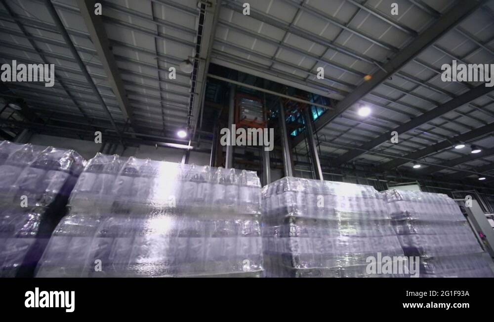 Elevator descends with goods near stack of packaged beer Stock Video ...