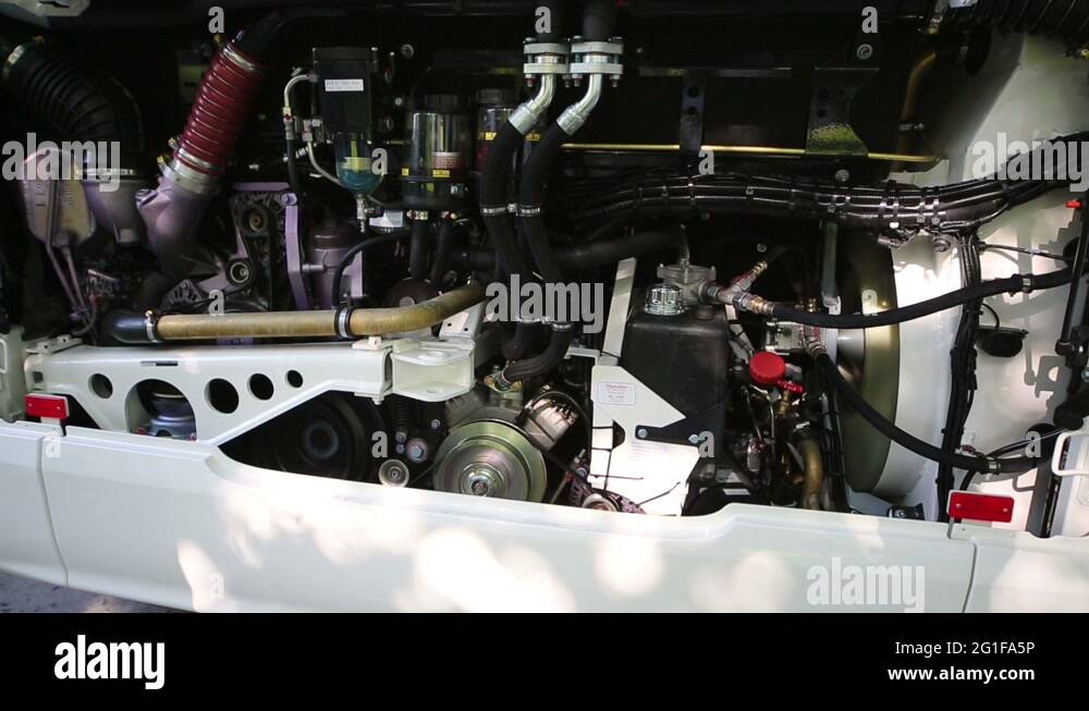 Driver closing the door to bus engine from inside bus Stock Video ...