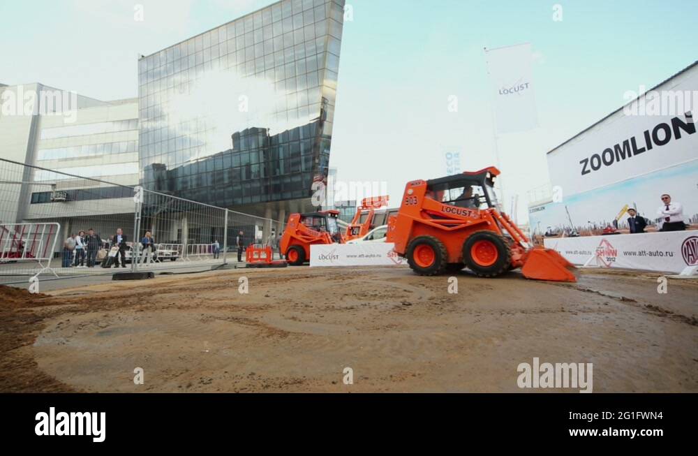 Man in locust loader shows its abilities in dirt Stock Video Footage ...