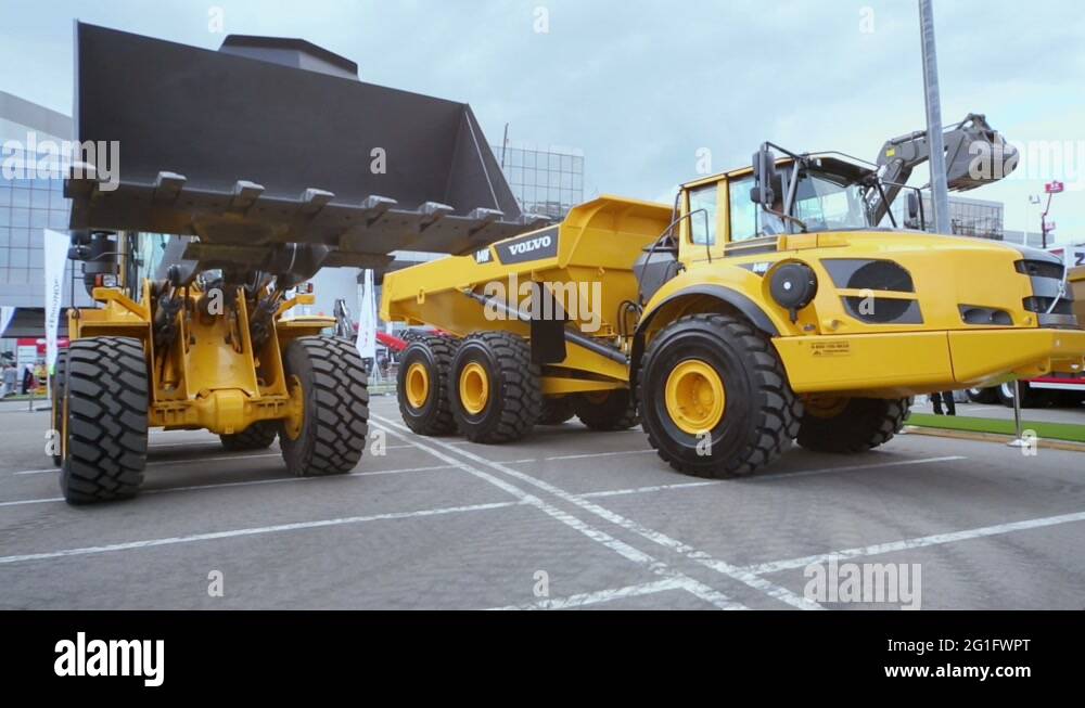 VOLVO loader lifts its bucket and articulated hauler Stock Video ...