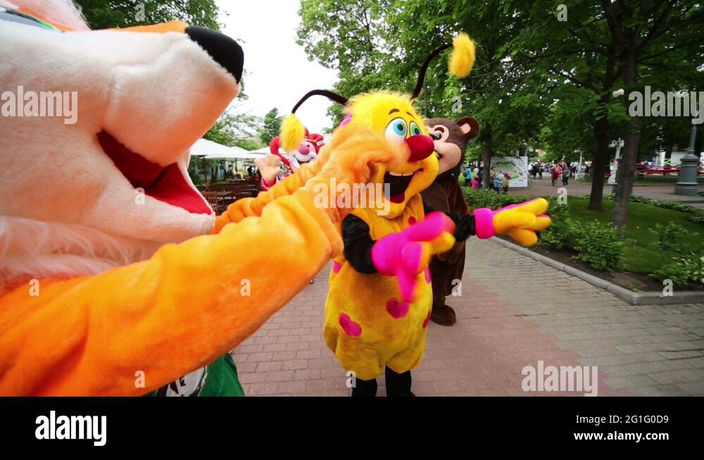 Actors dressed in cartoon characters waving Stock Video Footage - Alamy