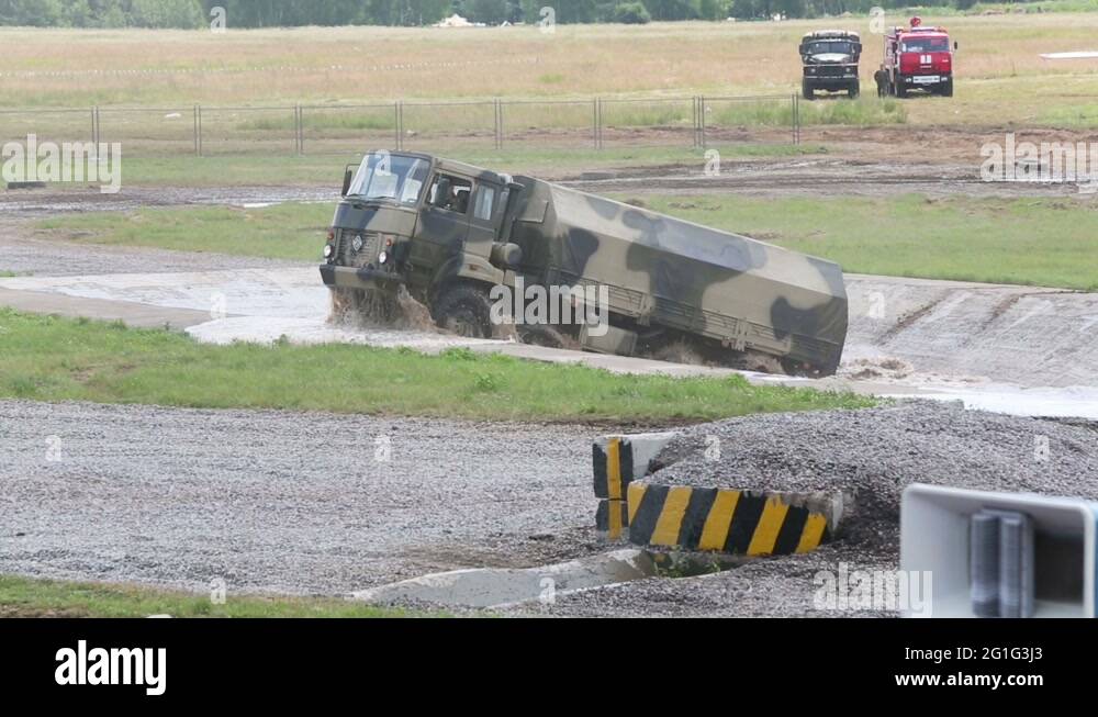 The military cars Ural-5323 and Ural-4320 overcome obstacles Stock ...