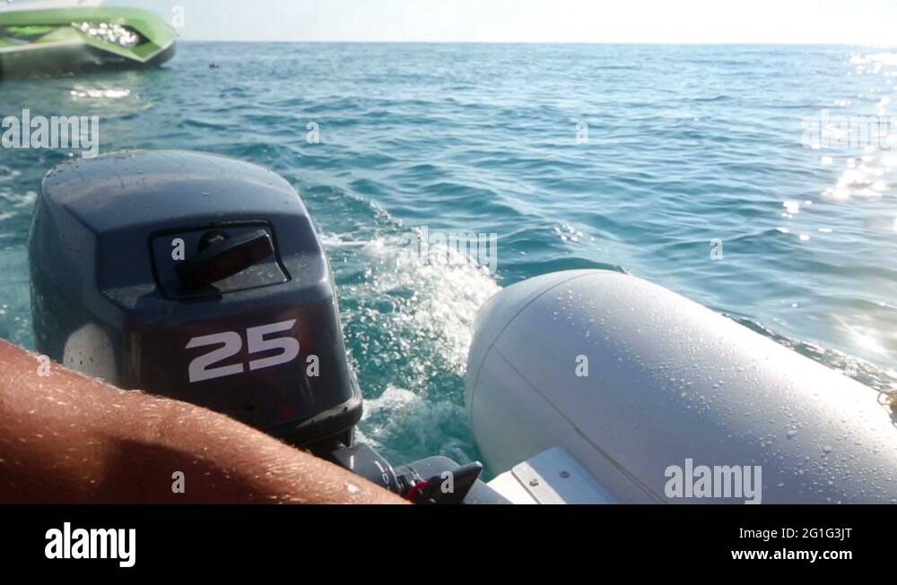 Mans hand control the motor boat by turning engine Stock Video Footage ...