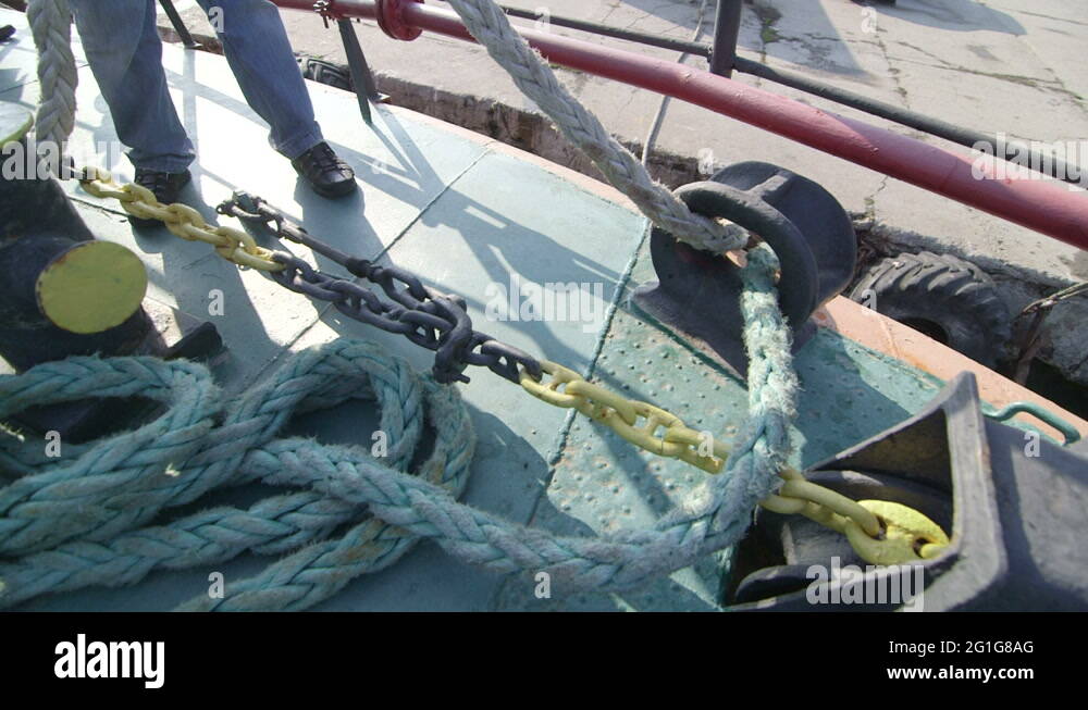 Sailor moors commercial fishing vessel to shore Stock Video Footage - Alamy