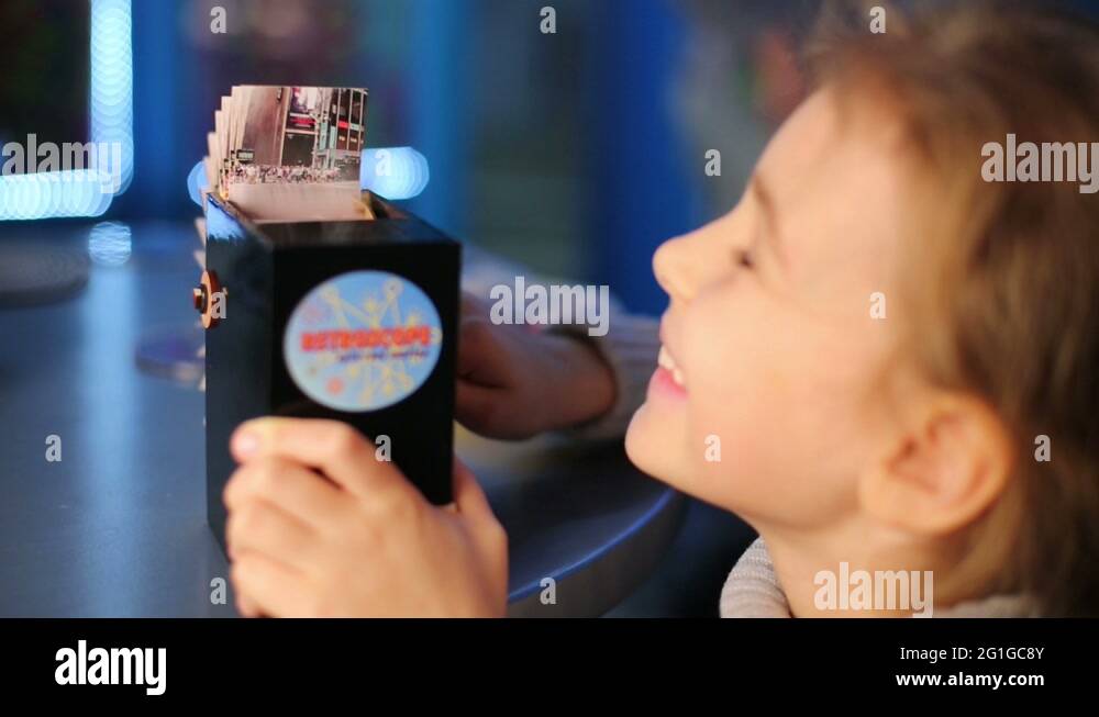 young Boy spinning device creates an animation Stock Video Footage - Alamy