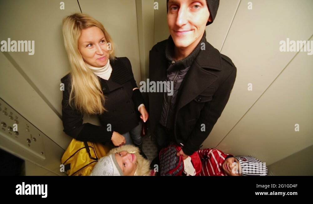 Father, mother, little son and daughter rise on elevator Stock Video ...