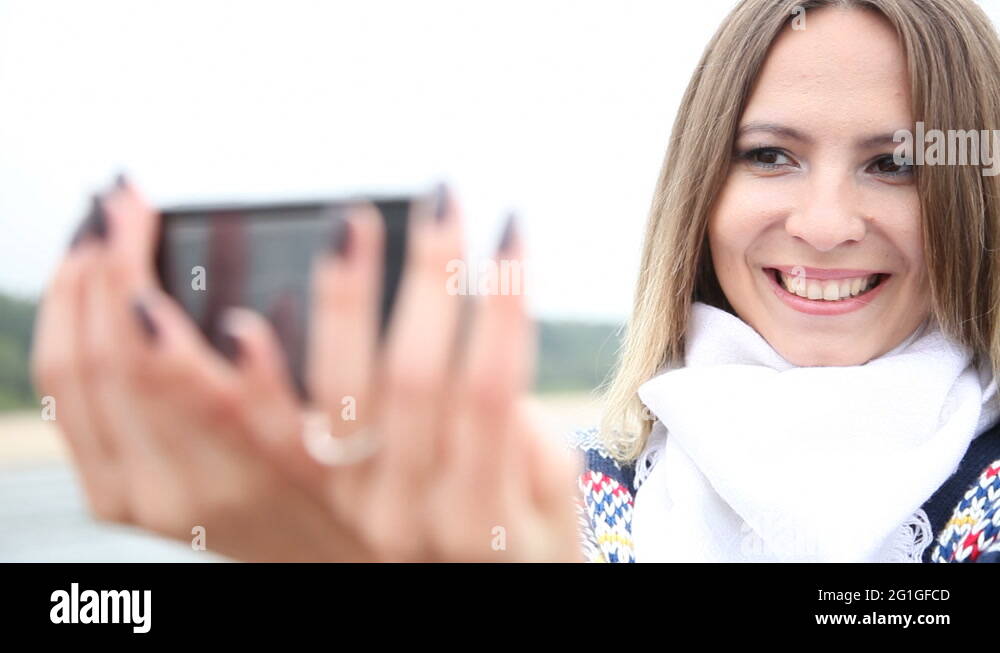 Happy girl taking photo of herself selfie Full HD with motorized slider ...
