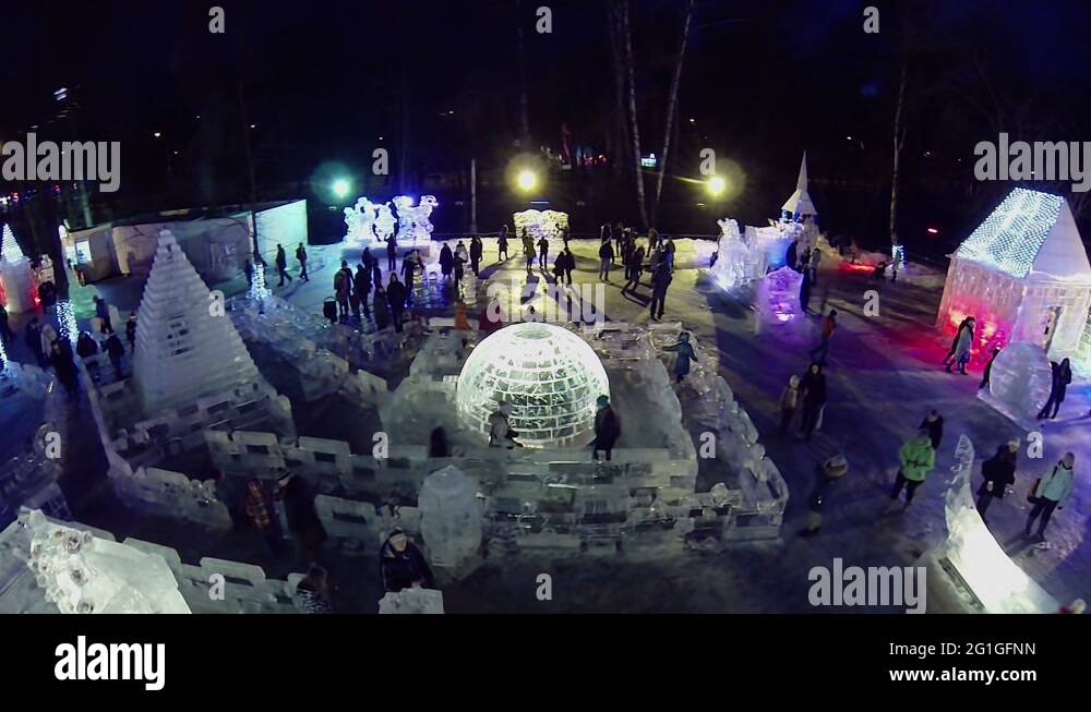 Many people watch art constructions in illuminated Ice Town Stock Video ...