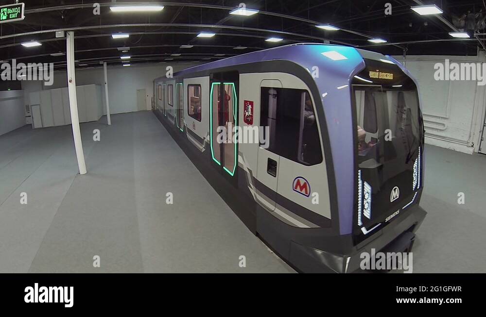 Family watch cabin of new metro train in presentation hangar Stock ...