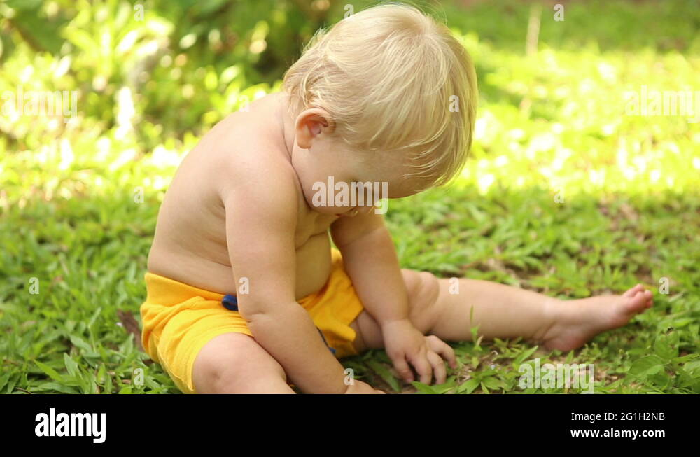 Sitting on the ground in the grass Stock Videos & Footage - HD and 4K ...