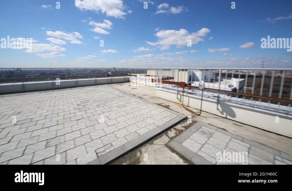 Square observation deck with lighting on tall building at day Stock ...