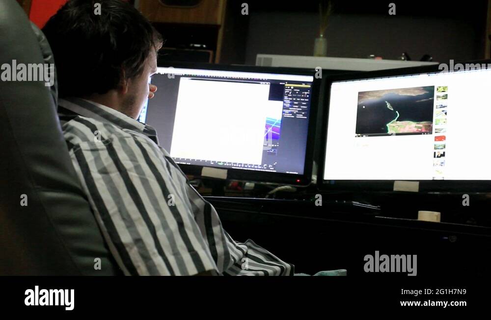 Late night office worker working overtime in dark office. HD. 1920x1080 ...