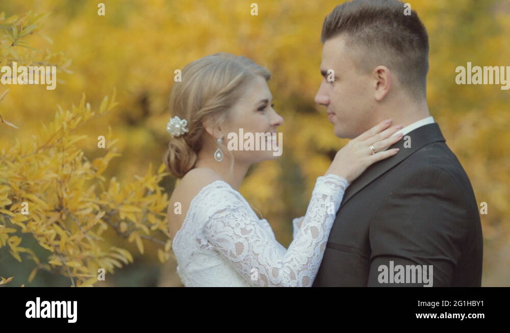 Gentle bride laughing and kissing groom Stock Video Footage - Alamy