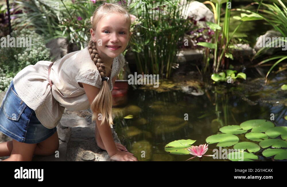 Little girl by a pond Stock Videos & Footage - HD and 4K Video Clips ...