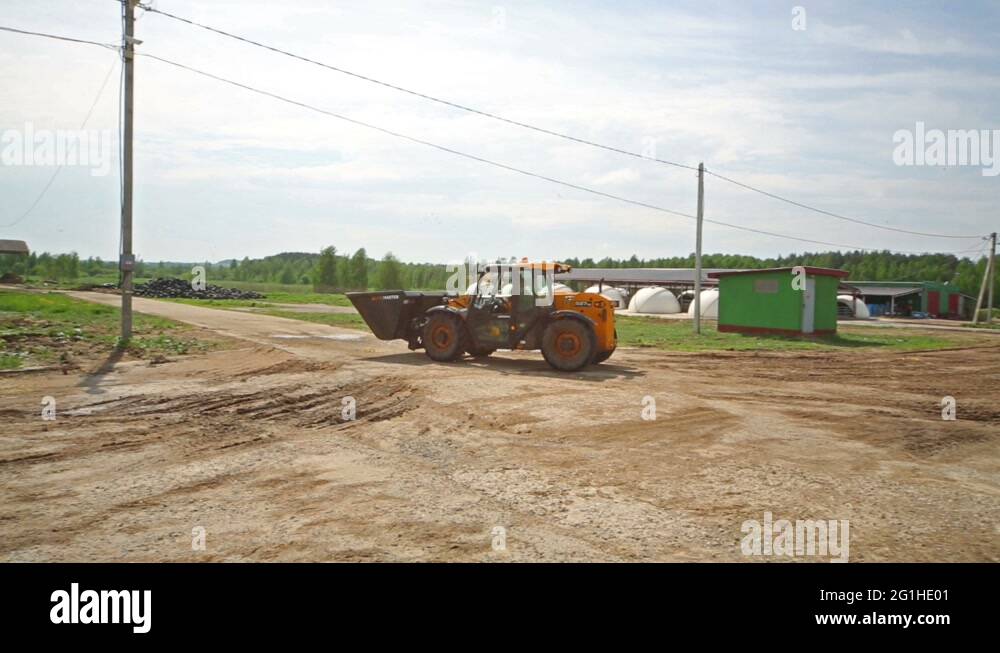 Tractor with scoop Stock Videos & Footage - HD and 4K Video Clips - Alamy