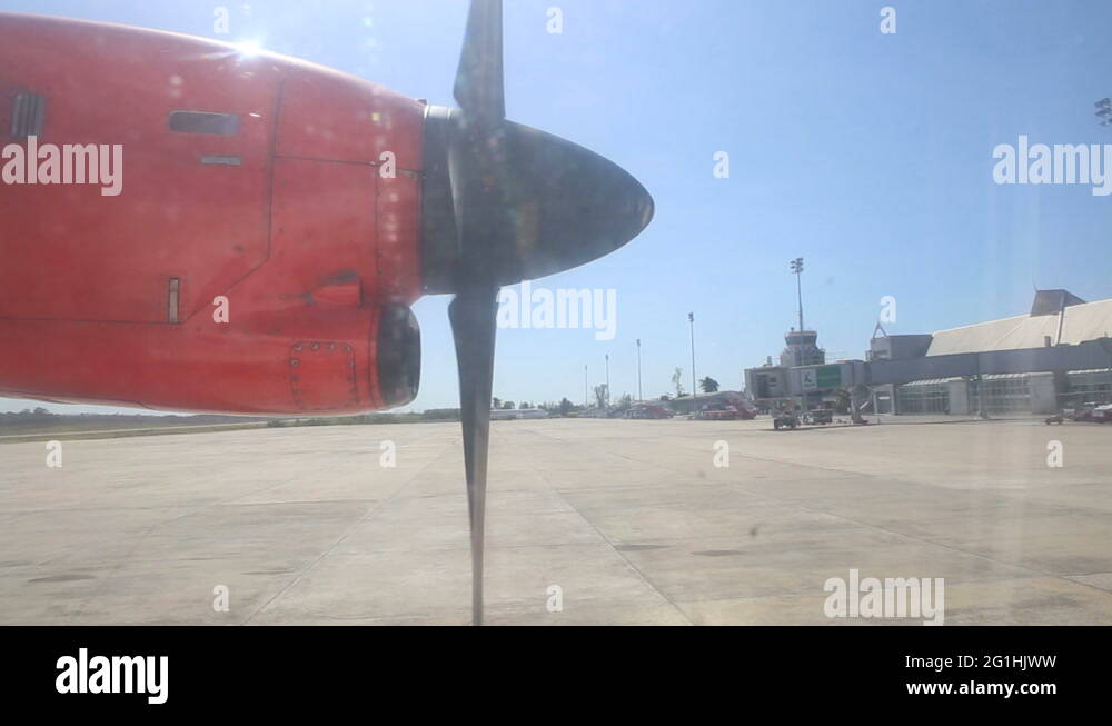 rotating aircraft engine propeller at background of airport Stock Video ...