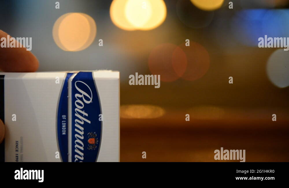 Man pulls Rothmans cigarettes Stock Video Footage - Alamy