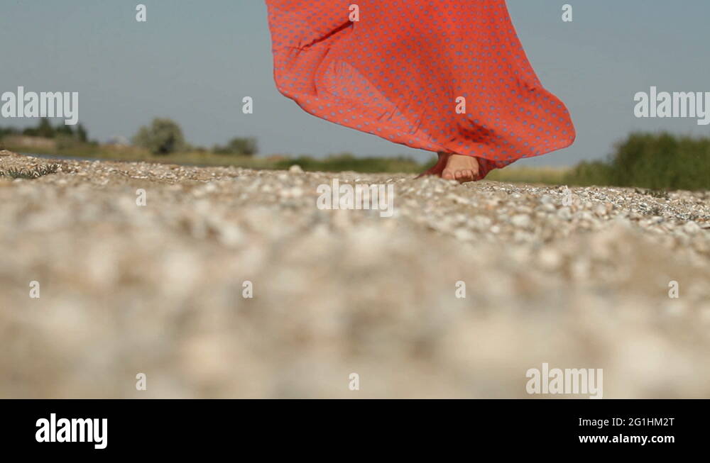 girl's legs on the beach made of shells Stock Video Footage - Alamy
