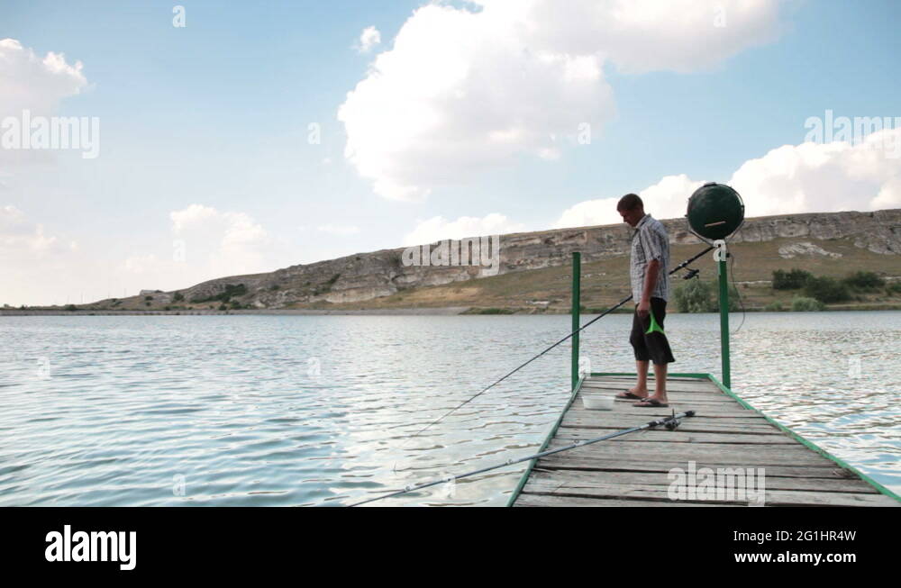 Man on jetty fishing Stock Videos & Footage - HD and 4K Video Clips - Alamy