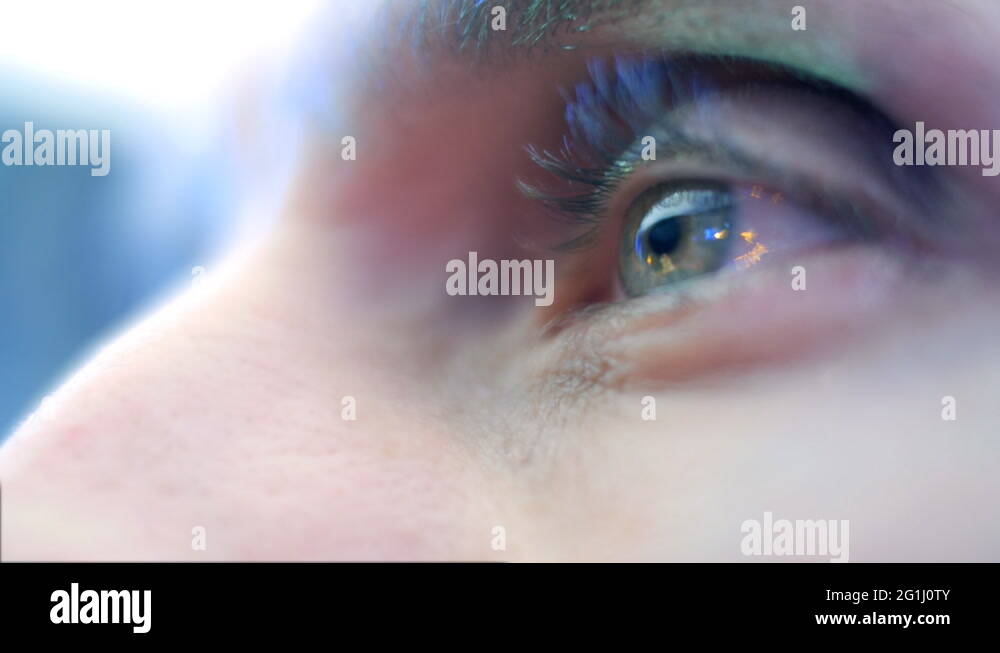 Reflection in the eye of the monitor screen when watching a movie ...