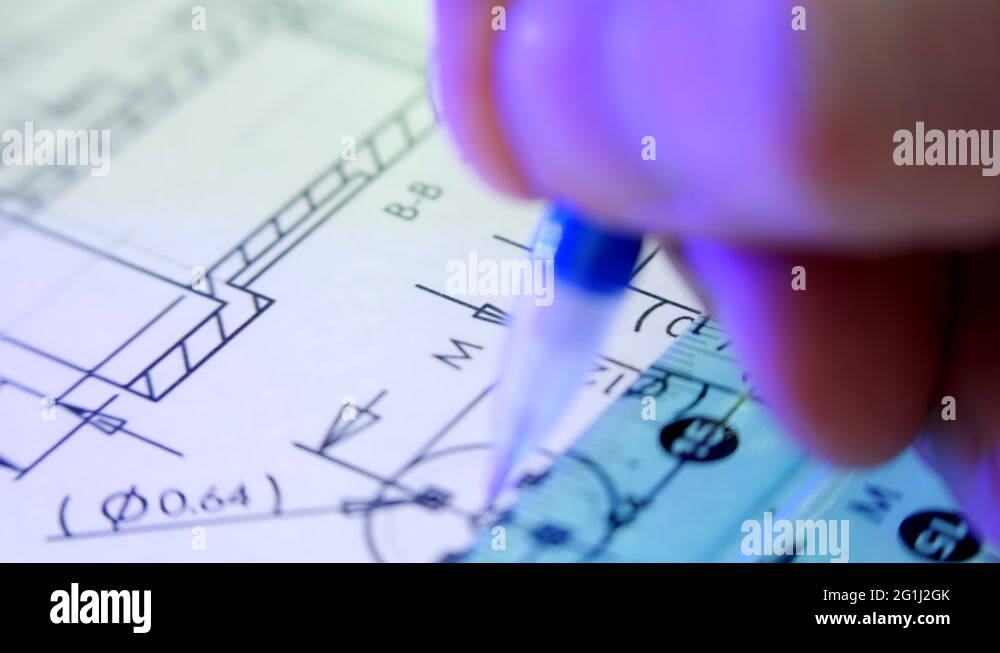Drawing a pencil line on the ruler on the drawing sheet Stock Video ...