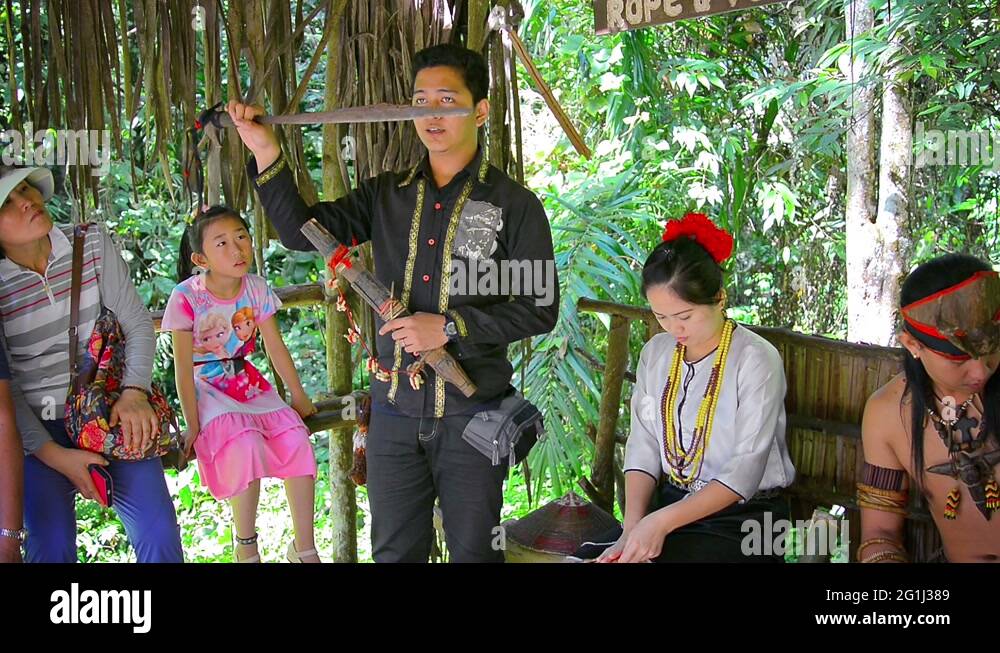 guide shows a traditional, native sword Stock Video Footage - Alamy