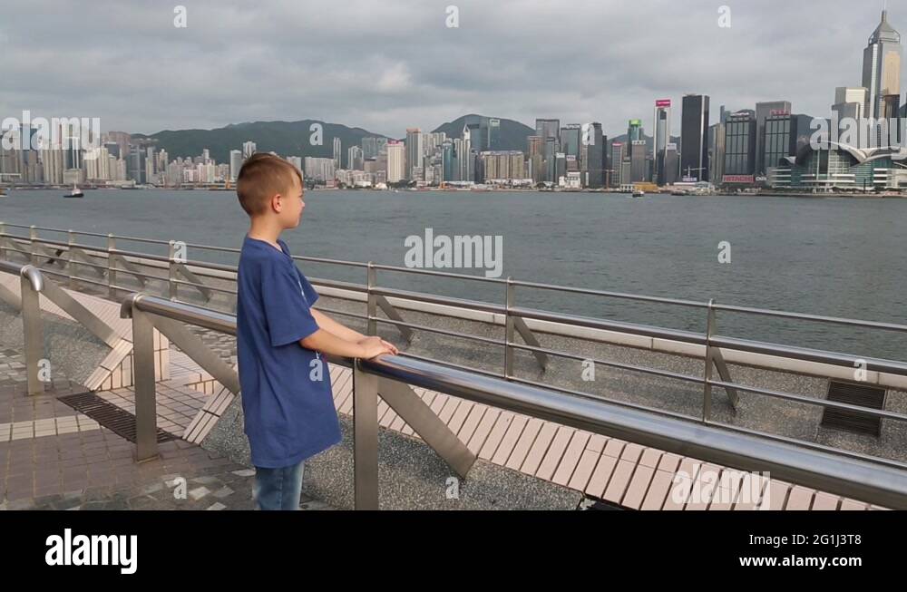 Boy is on the waterfront at the Kowloon Public Pier, Hong Kong Stock ...