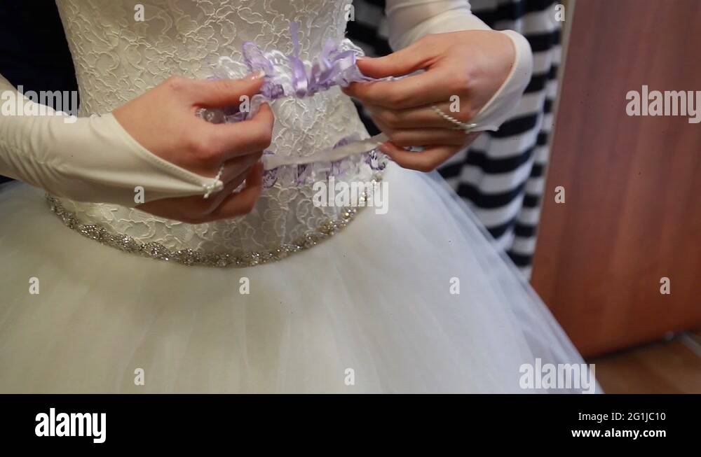 Young bride getting dressed into her wedding gown Stock Video Footage ...