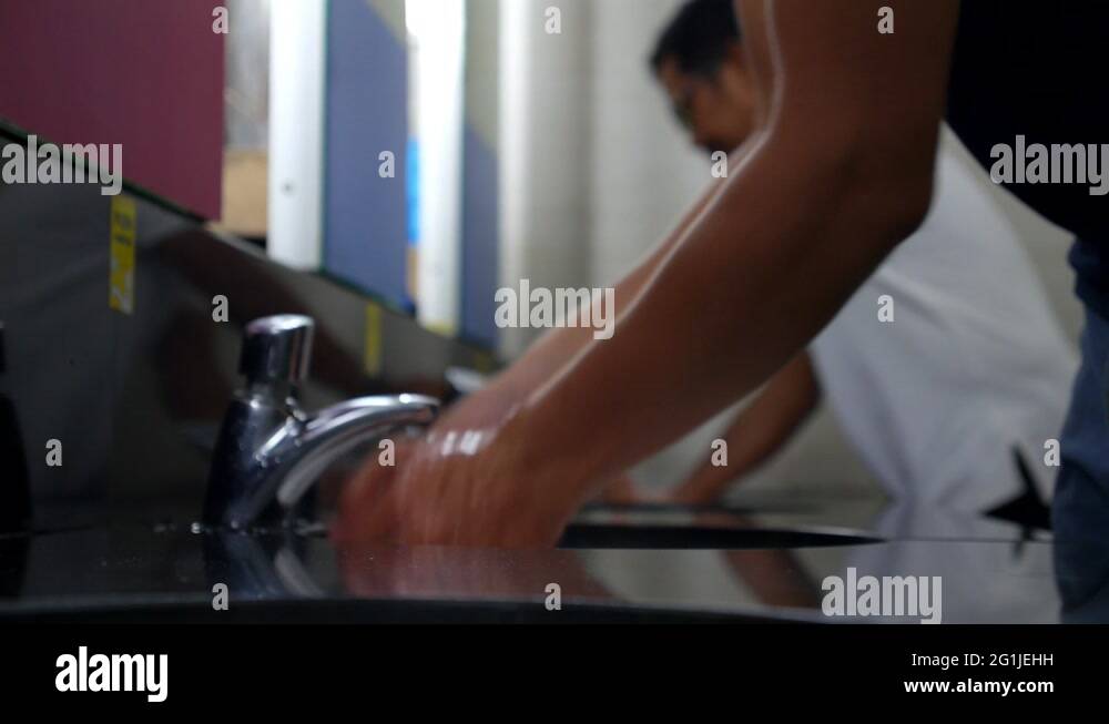 Man Washing Hands in Toilet Stock Video Footage - Alamy