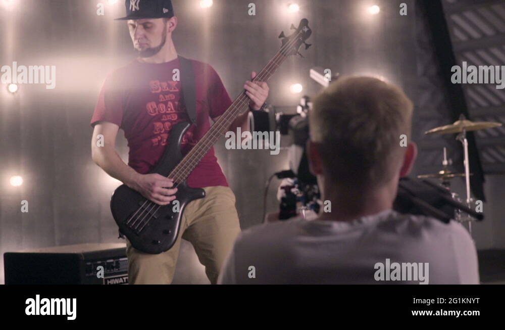 Behind the scenes. An operator film a scene of musical video with rock ...