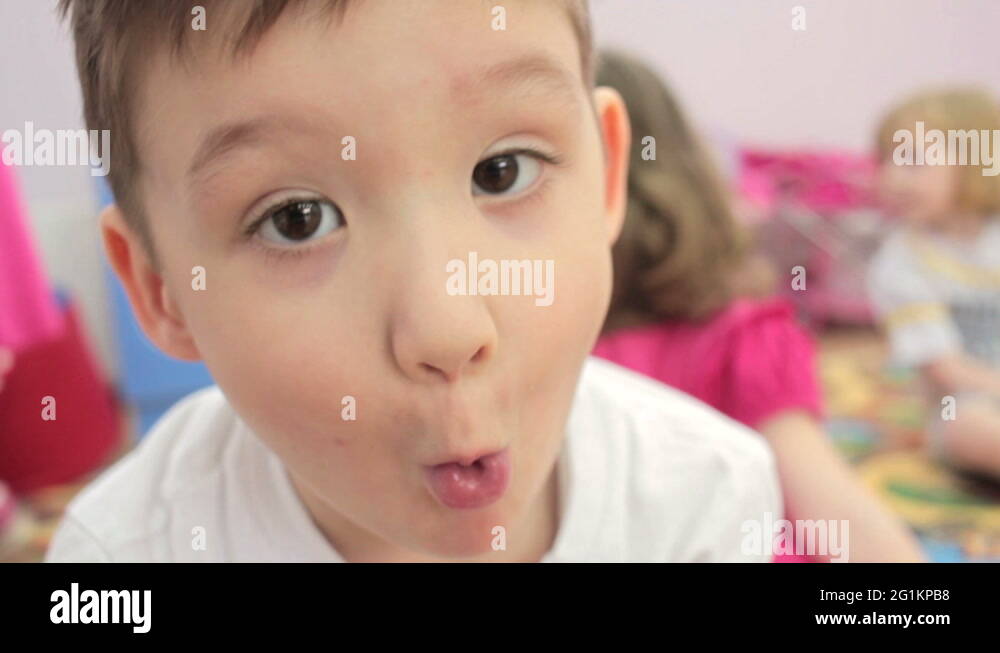 Little boy making a funny face in the kindergarten Stock Video Footage ...