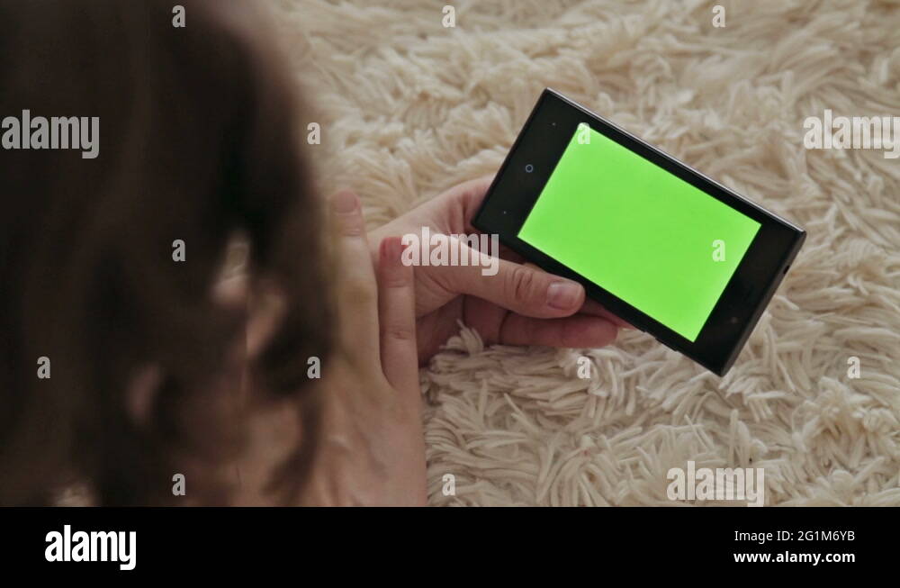 Woman using a mobile phone with green screen, scrolling phone Stock ...