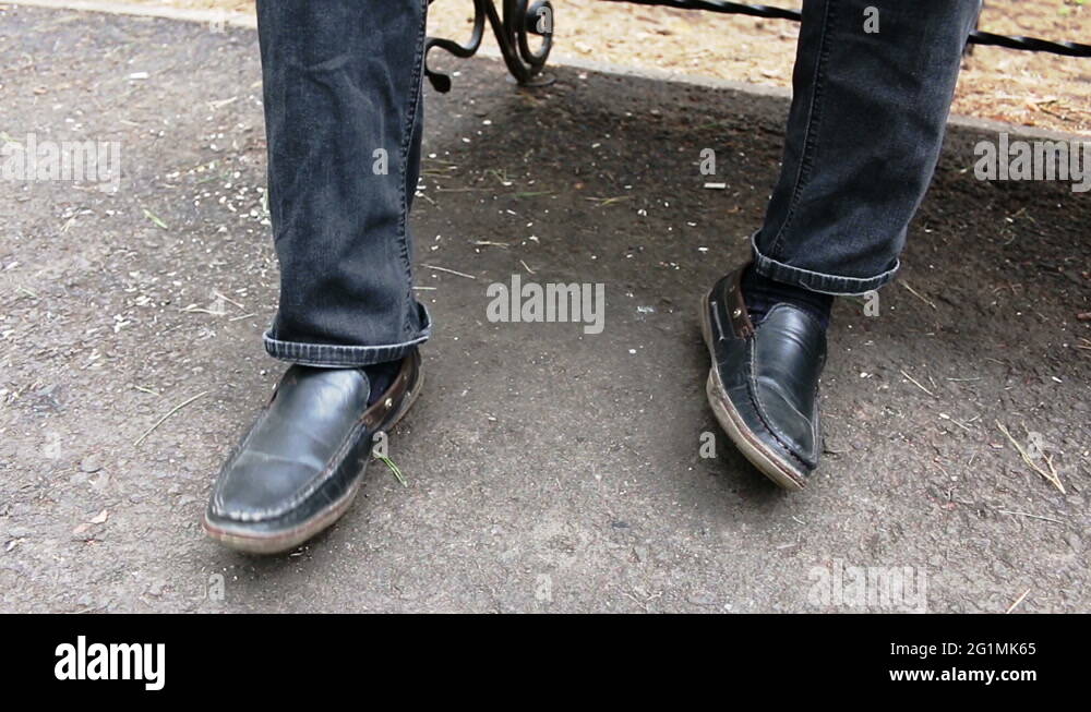 Black patent leather men's shoes stomping or fills rhythm on open air ...