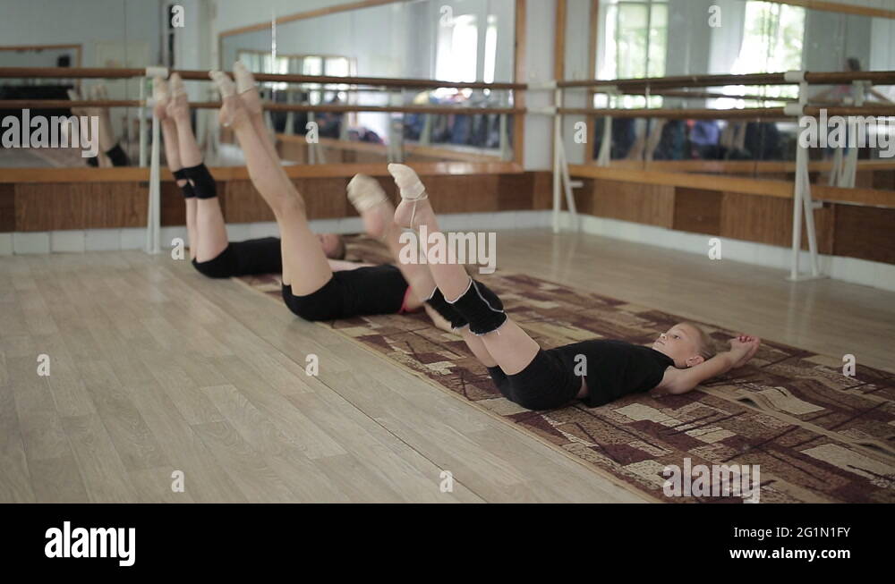 Three girls gymnasts perform exercises in the gym Stock Video Footage ...