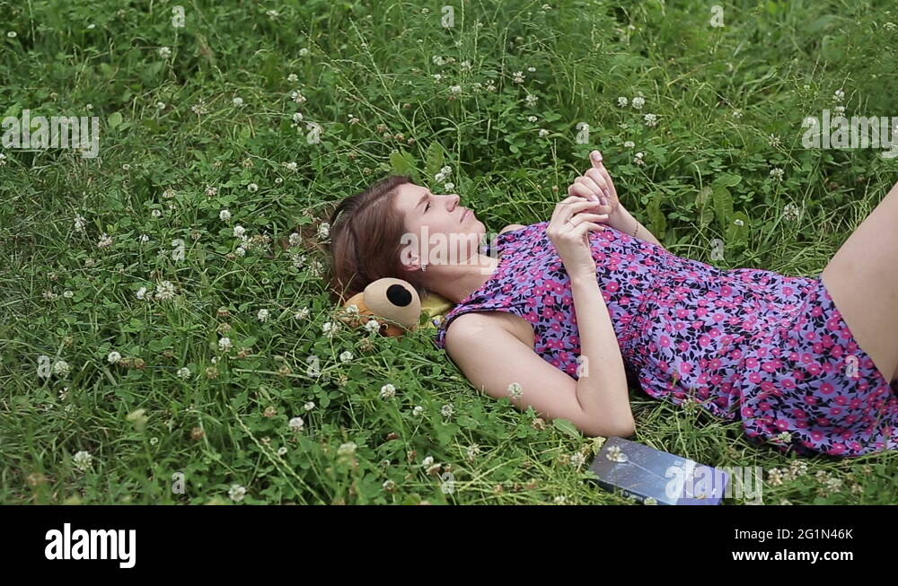 Beautiful Girl Lying Down Of Grass Stock Video Footage Alamy