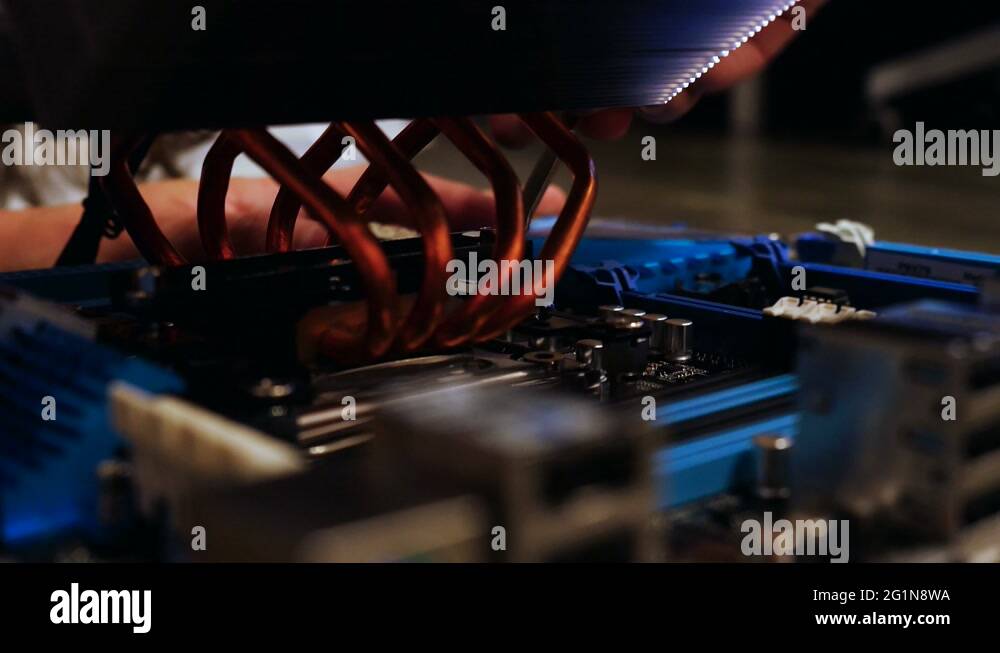 Setting up cooler to CPU processor at motherboard. 3840x2160 Stock ...
