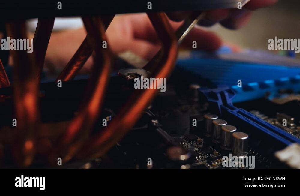 Setting up cooler to CPU processor at motherboard. 3840x2160 Stock ...