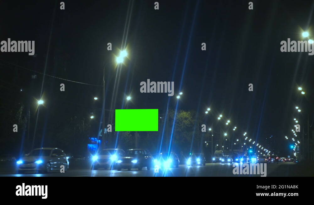 Billboard with a Green Screen on Night Street. Night city street with ...