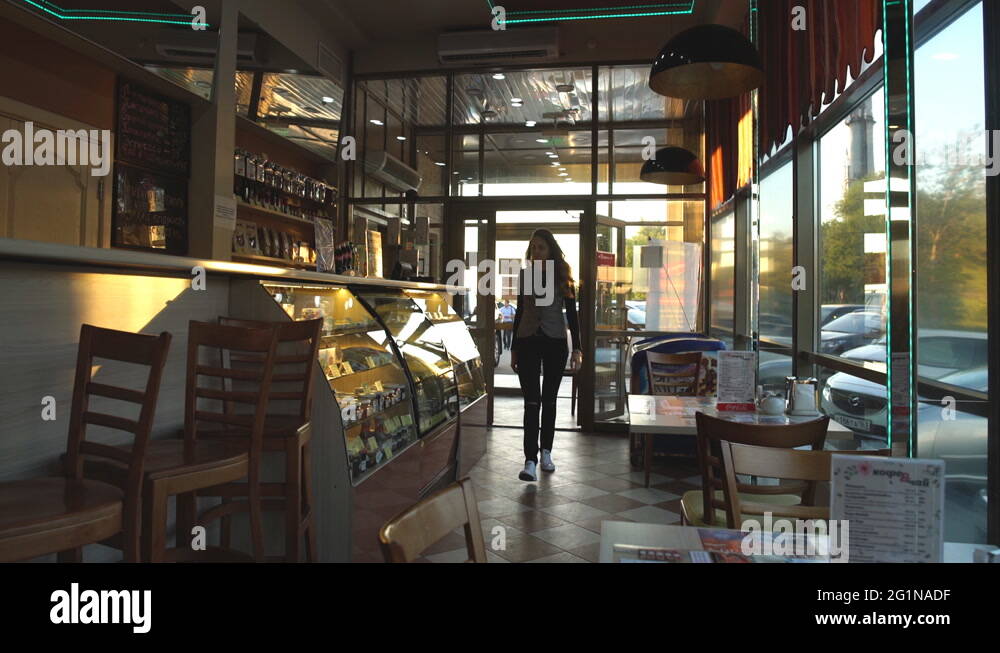 the girl in the cafe at the window Stock Video Footage - Alamy