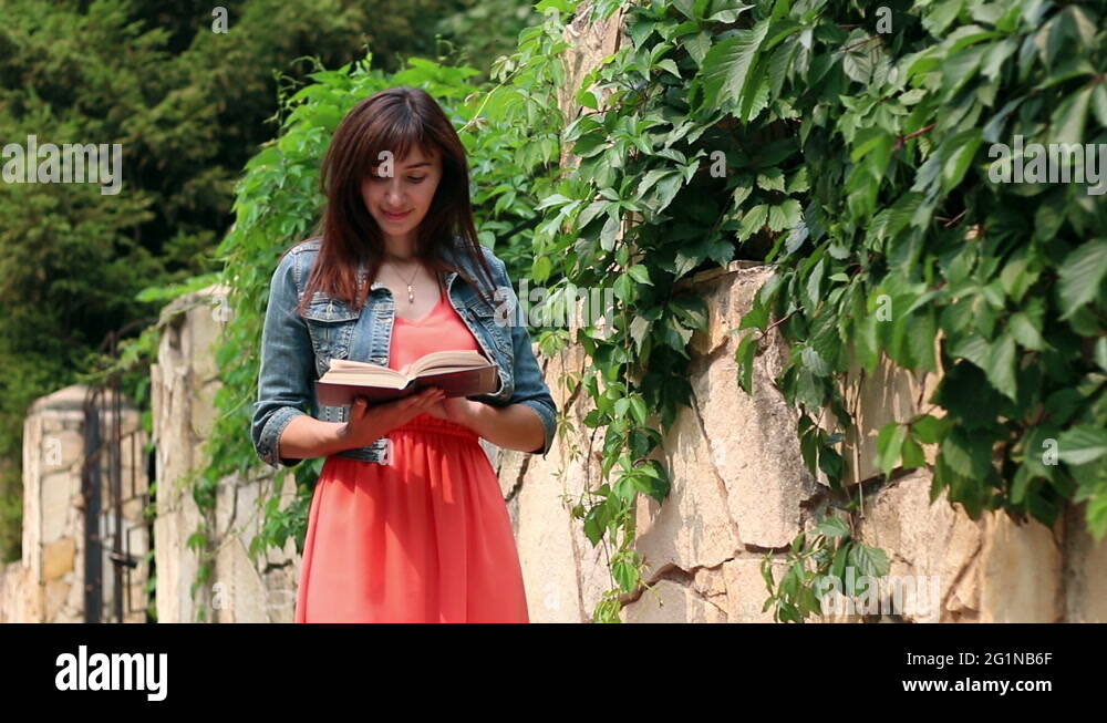 Standing girl reading book Stock Videos & Footage - HD and 4K Video ...