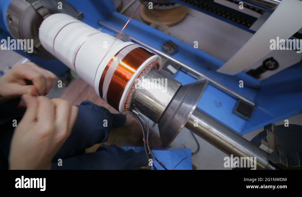 Transformer, engine production. Worker operates with electric cooper ...
