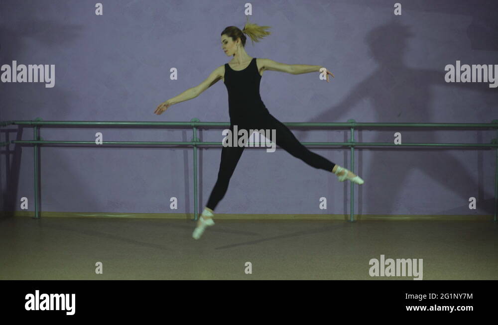 Young caucasian ballerina girl showing various ballet steps and ...