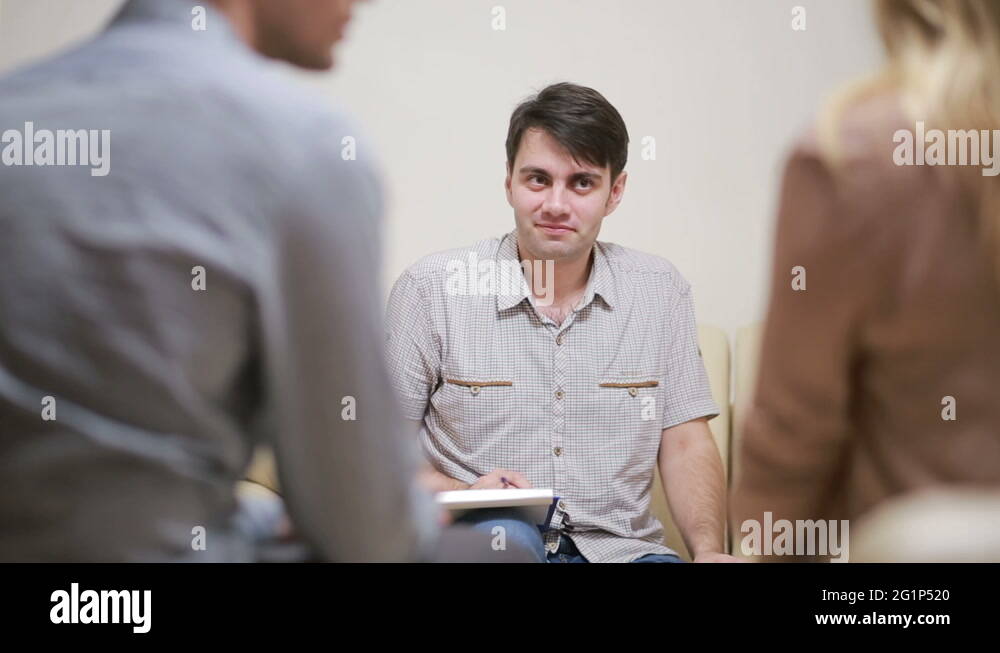 male psychologist helping worried young couple. family therapy. angry ...