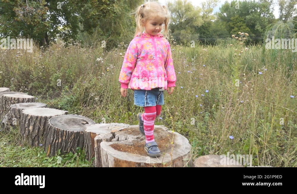 Baby girl sitting on stump Stock Videos & Footage - HD and 4K Video ...