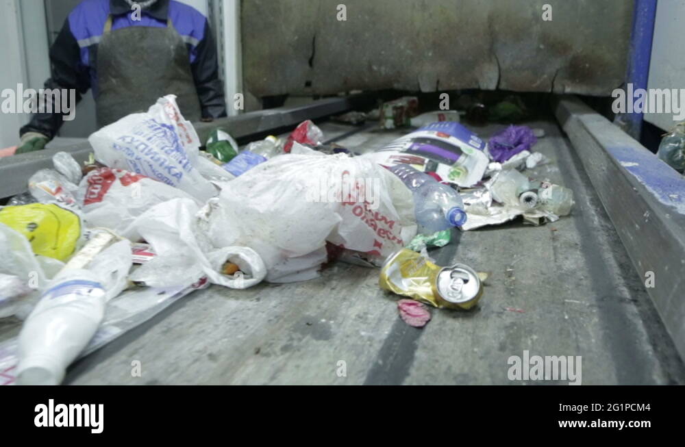Plastic bottle on the sorting conveyor. Waste sorting. Recycling waste ...