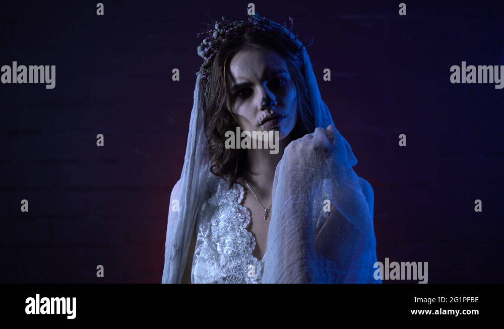 Horror halloween scene of a corpse bride with sad face and sewed mouth ...