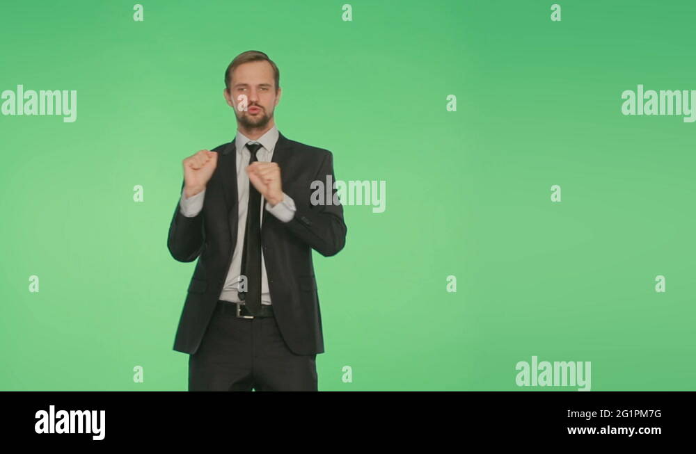 body language. a man in a business suit on a green background, hromakey ...