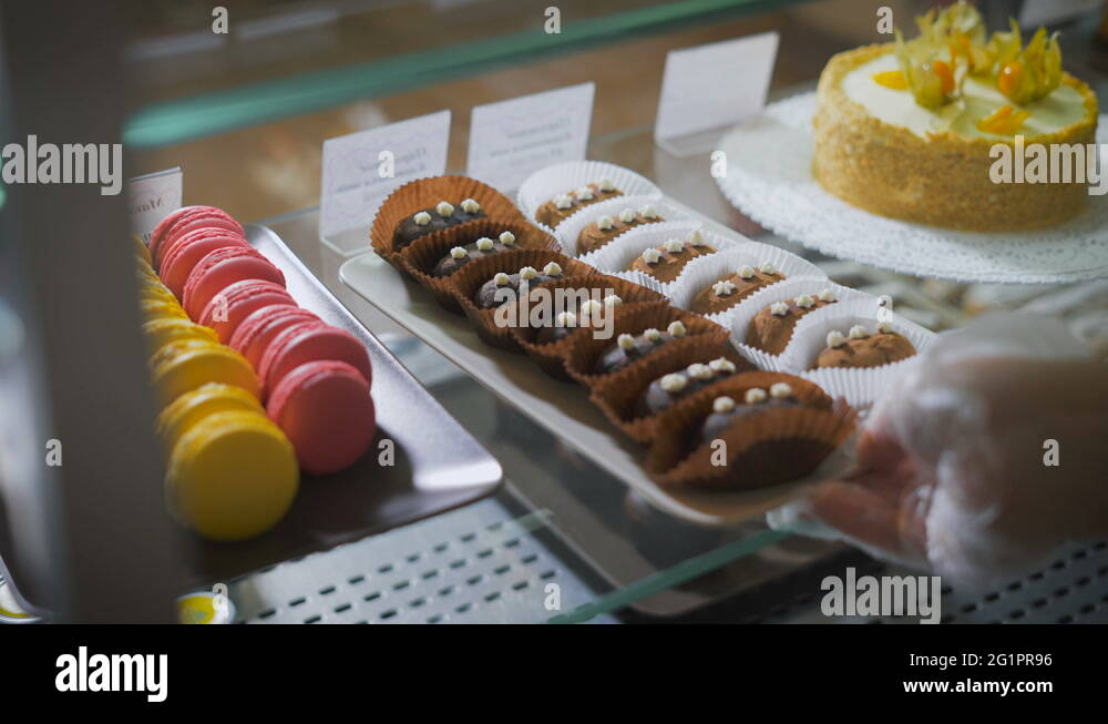 Coffee and pastry bar. Counter. On a glass surface desserts are exposed ...