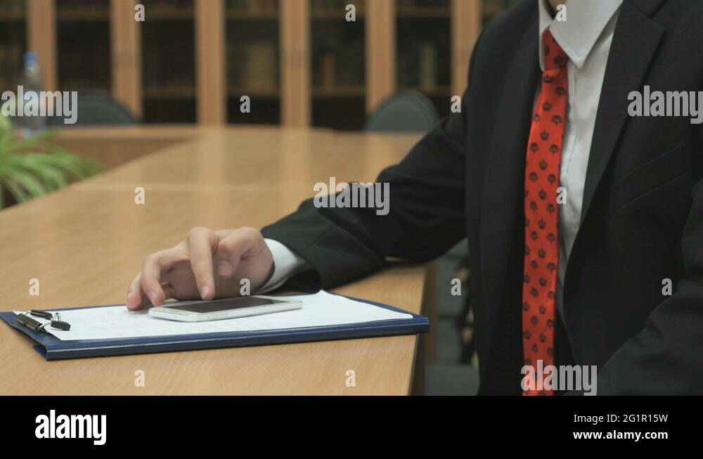 Man sitting writing the text using a mobile phone Stock Video Footage ...