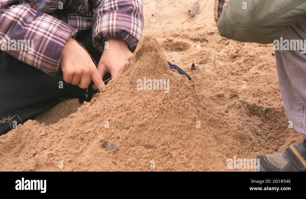 Two boys playing in the sand Stock Videos & Footage - HD and 4K Video ...